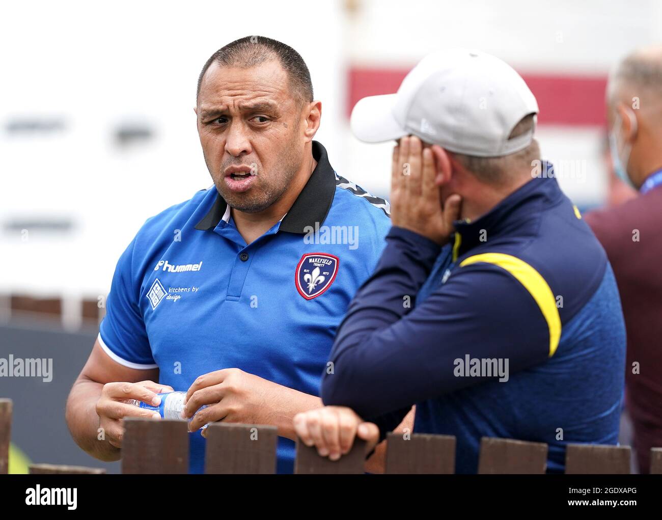 Wakefield Trinity head coach Willie Poching (left) and Warrington ...
