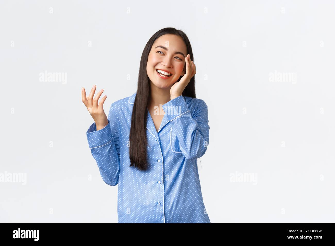 Beautiful asian girl getting ready sleep, touching soft clean face ...