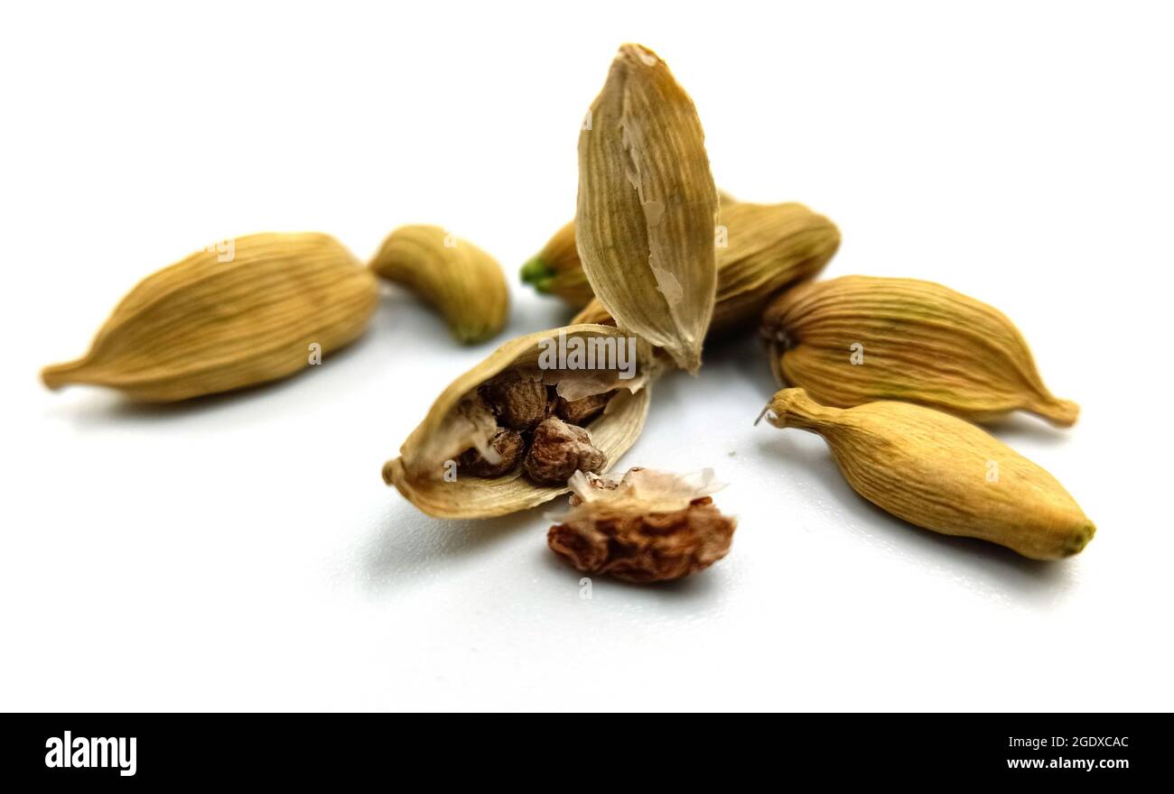 A pile of cardamom seeds isolated on white background Stock Photo - Alamy