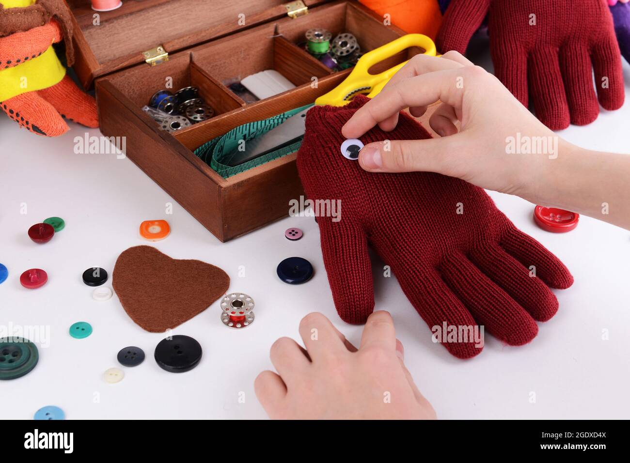 Making of handmade toys from gloves on white background Stock Photo - Alamy
