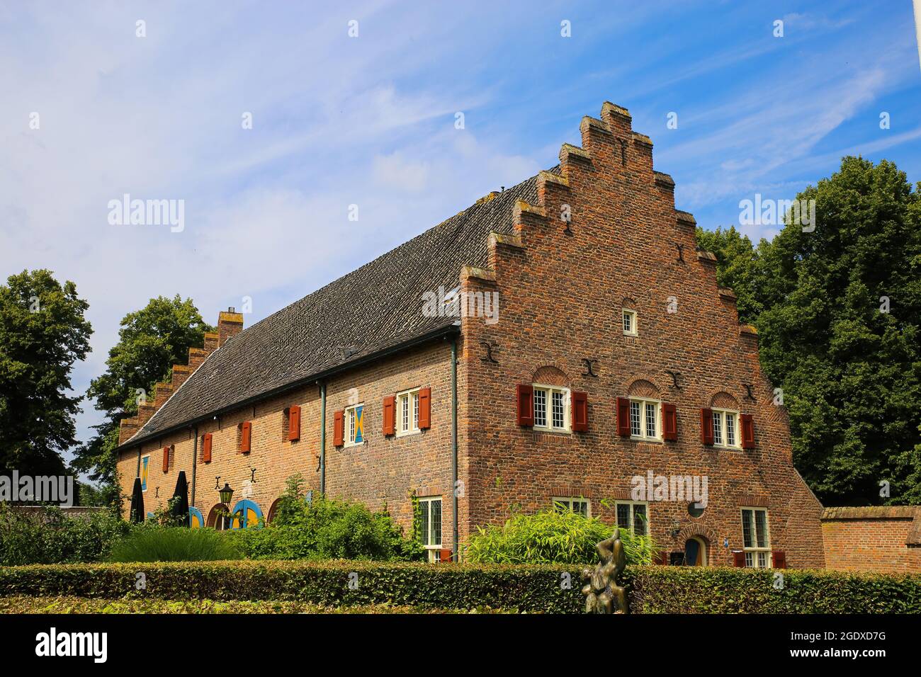 View on typical dutch medieval gabled stone house with garden and green ...