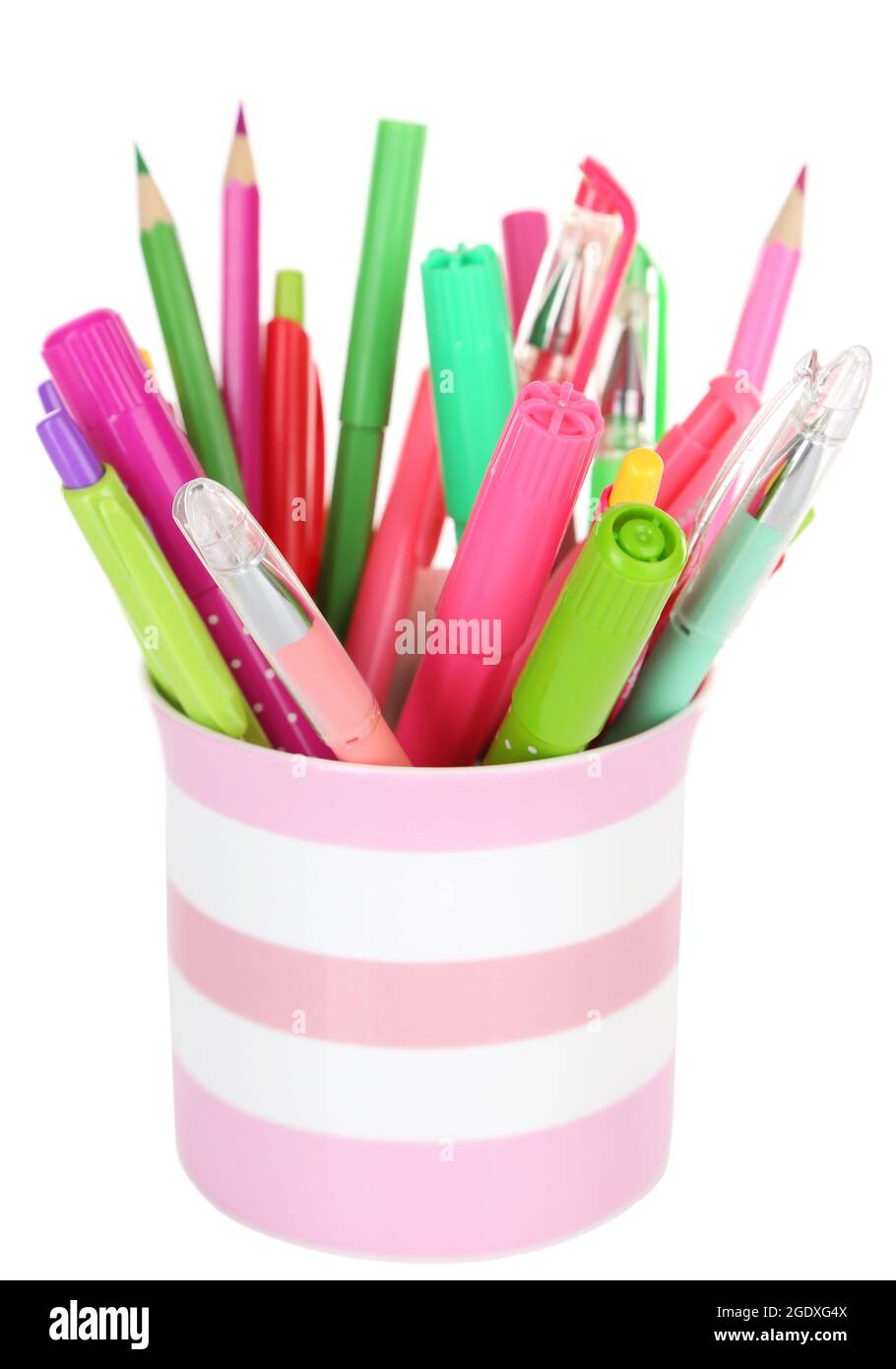 Colorful pens,pencils and markers in striped plastic cup isolated on ...