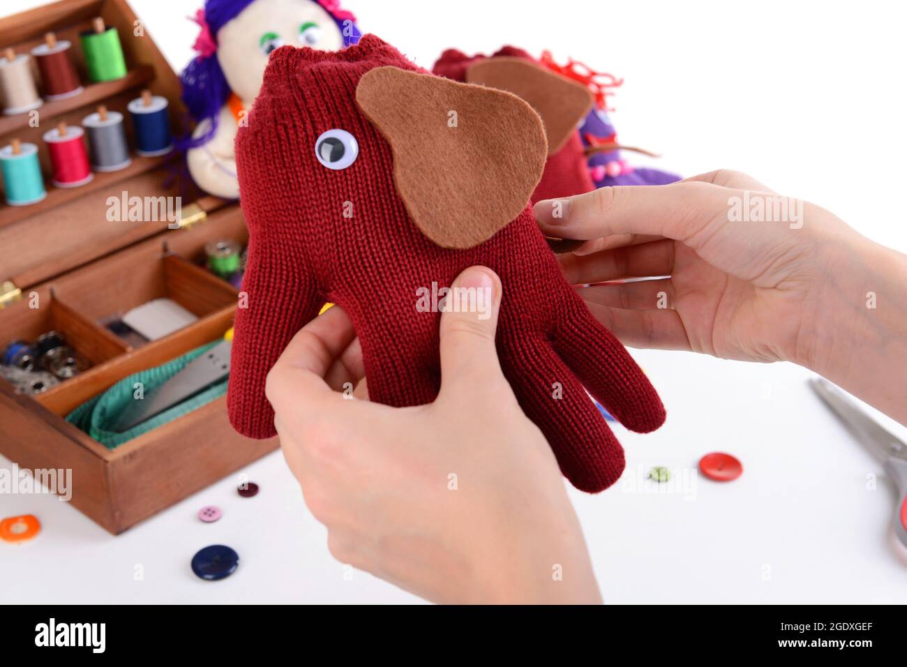 Making of handmade toys from gloves on white background Stock Photo - Alamy