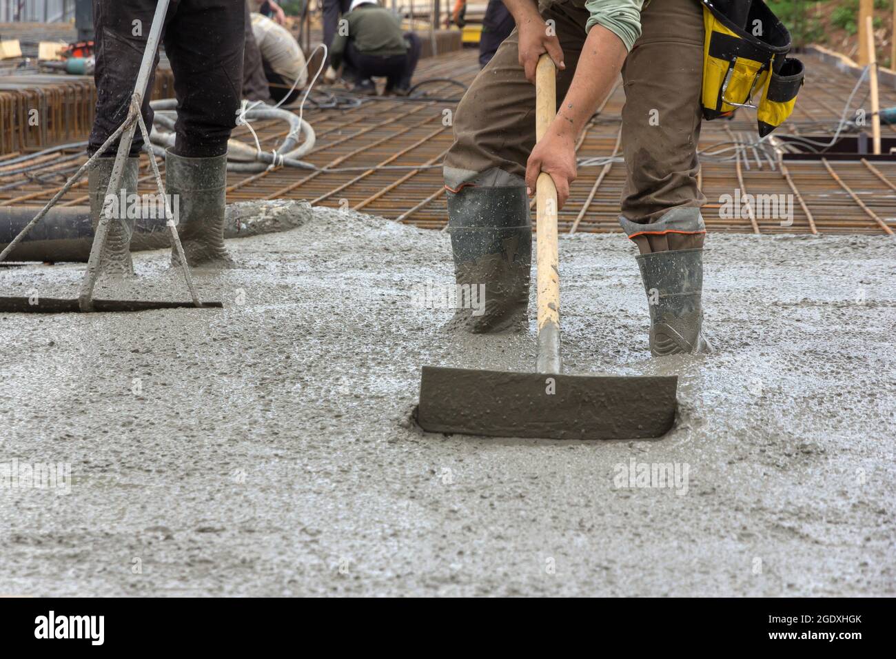 The process of pouring a monolithic slab at a construction site ...