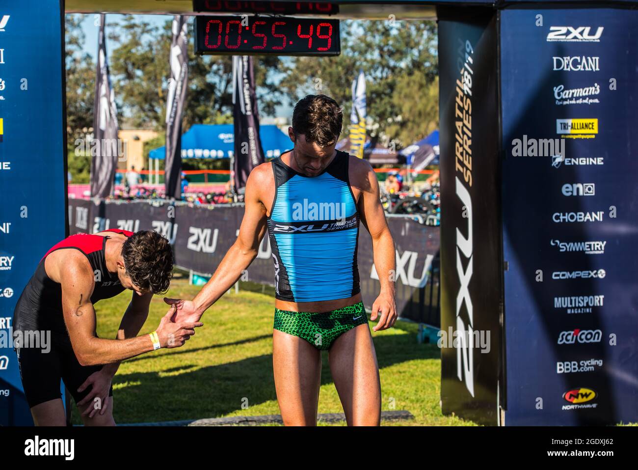 Finish line handshake between Elite triathletes Steve McKenna and ...