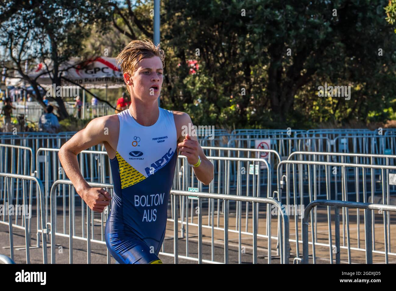 Junior triathlete Harry Bolton runs past the barriers during the 2XU ...