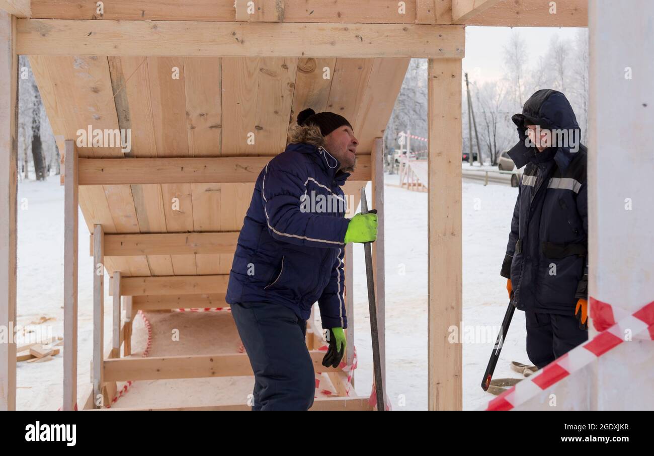 Worker on timber frame construction with crowbar in hand Stock Photo ...