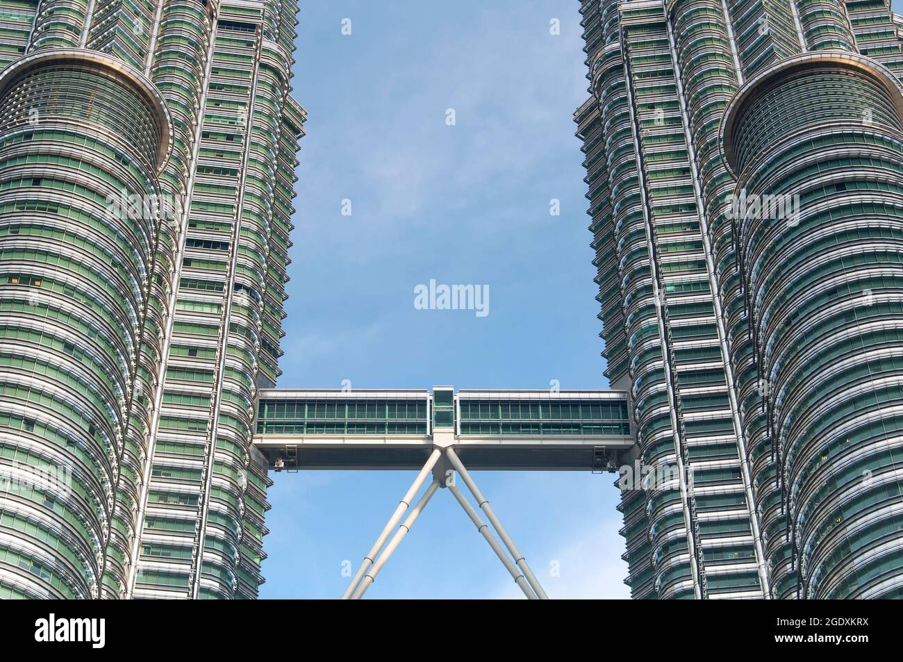 The famous twin petronas towers joined by a connecting walkway in kuala ...