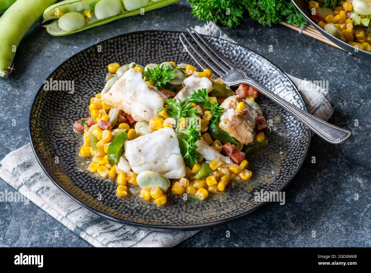 Cod, sweetcorn and broad beans succotash Stock Photo - Alamy