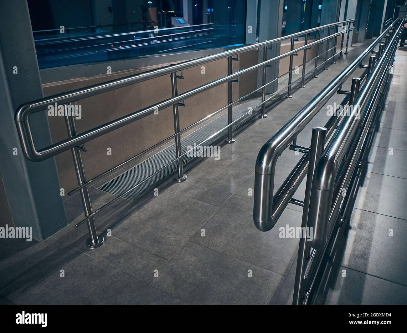 Ramp for people with disabilities and chrome railings Stock Photo - Alamy