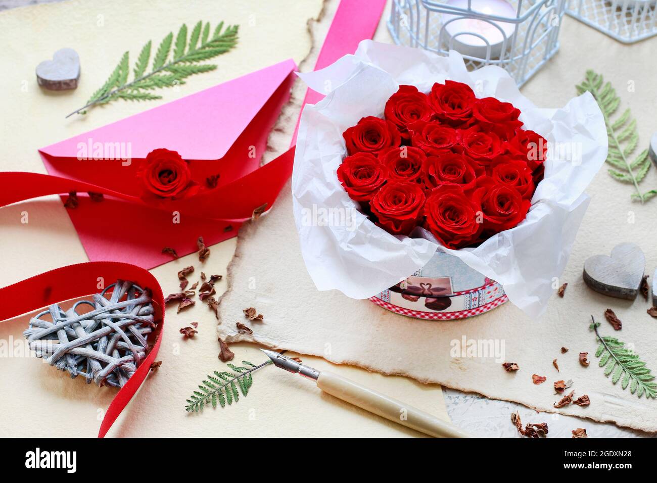 Valentine's Day decorations: box with red roses, vintage paper for ...