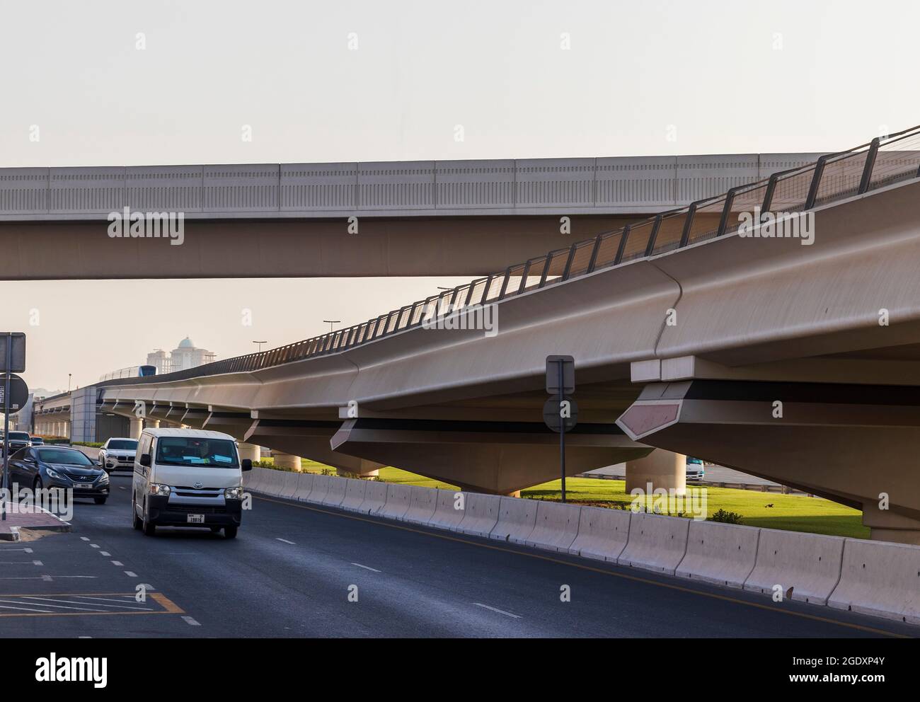 Dubai, UAE - 08.14.2021 - Metro train approaching flyover bridge Stock ...