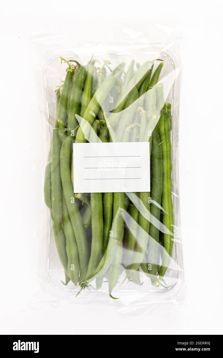 Package of green french beans with white label in isolated white ...
