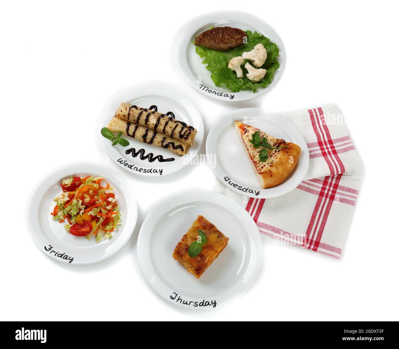 Daily menu. Plates with food on table Stock Photo - Alamy