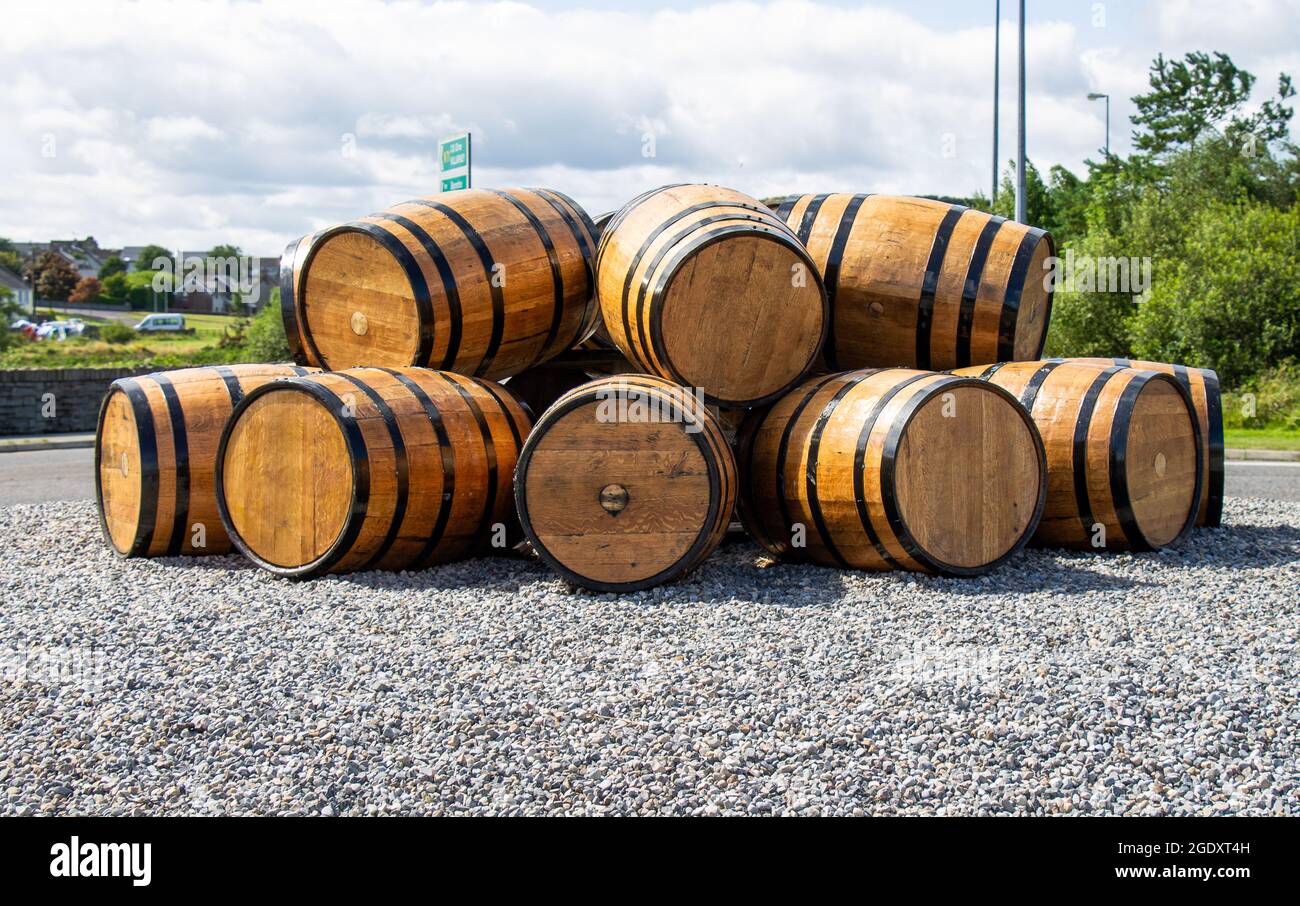Whiskey barrels or casks stacked on middle of roundabout forming ...