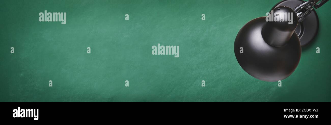 Black table lamp on green board. Concept back to school. Mock up for ...