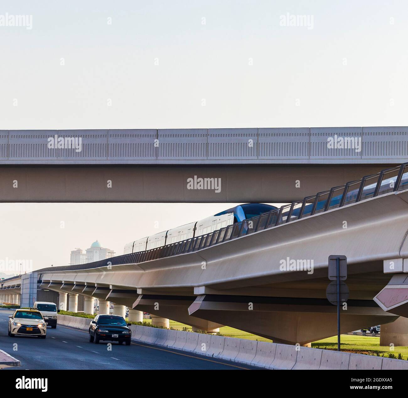 Dubai, UAE - 08.14.2021 - Two metro trains under flyover bridge Stock ...