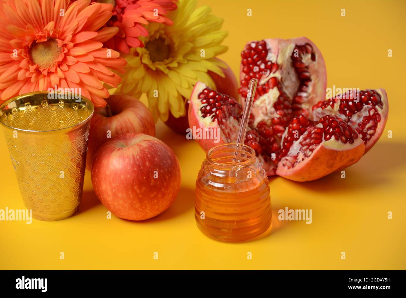 Rosh hashanah (jewish New Year holiday) concept. Traditional symbols-Honey jar, apples and ...