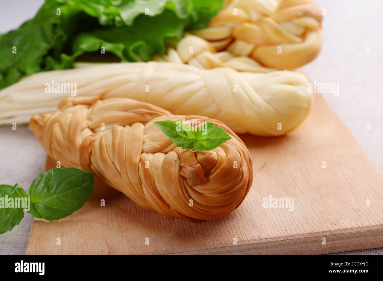 Smoked braided cheese close-up Stock Photo - Alamy