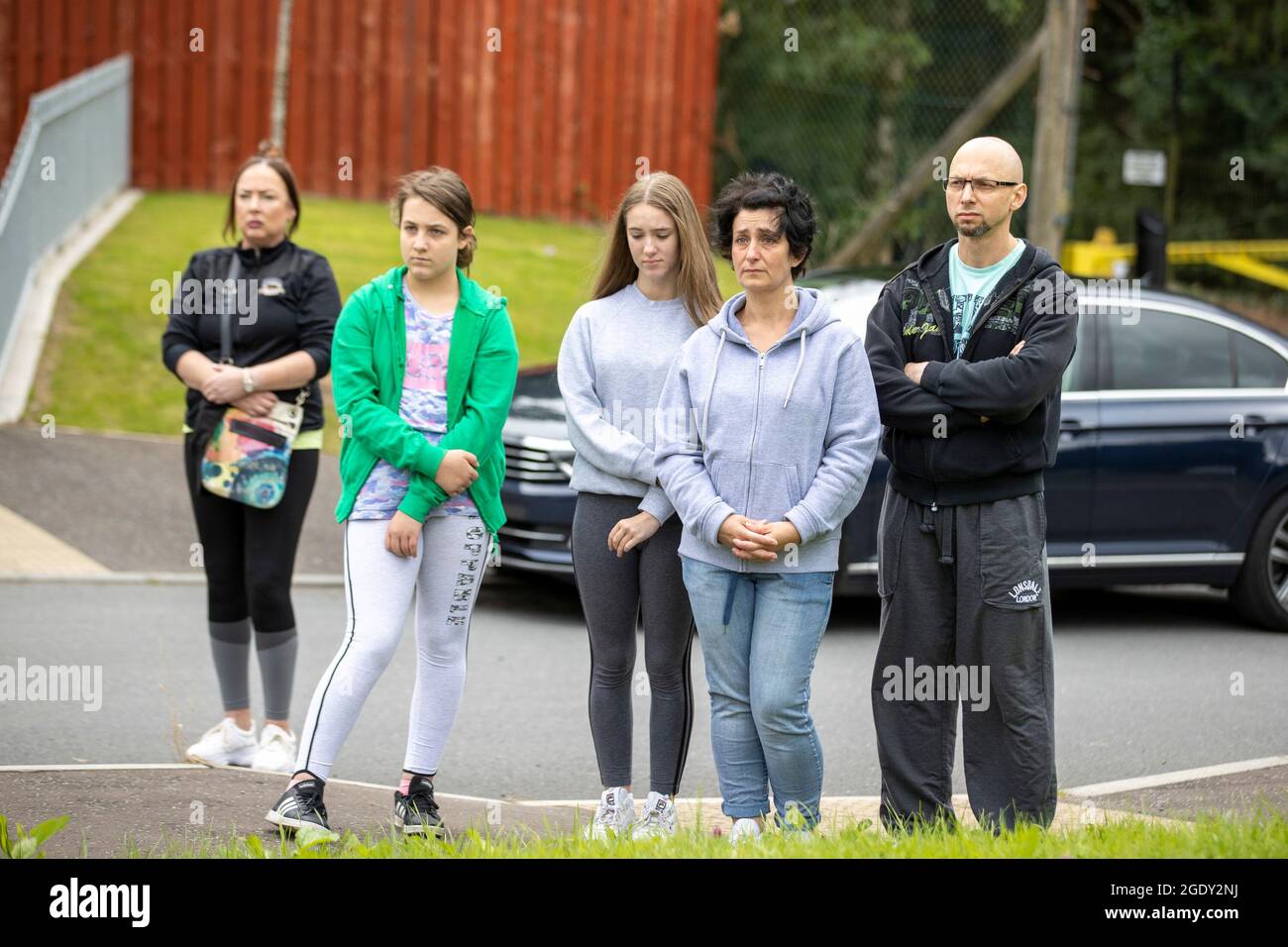 People standing together in remembrance during a vigil in Dungannon, Co ...