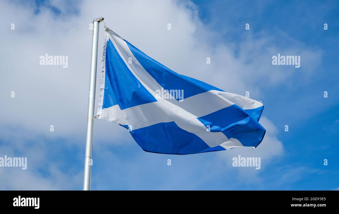 Scottish saltire flying in the wind hi-res stock photography and images ...