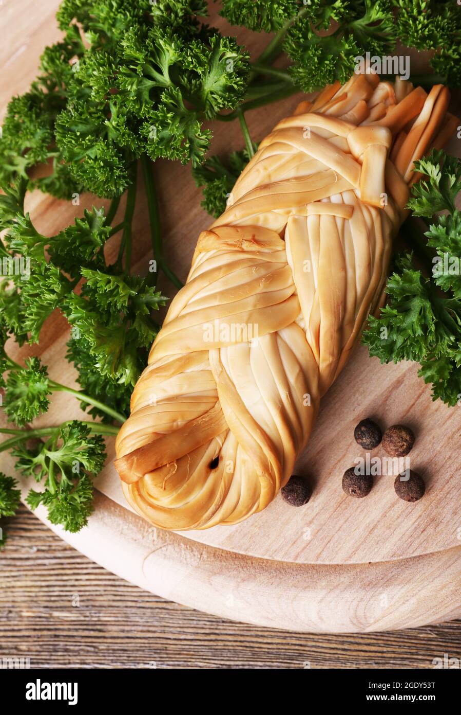 Smoked braided cheese close-up Stock Photo - Alamy