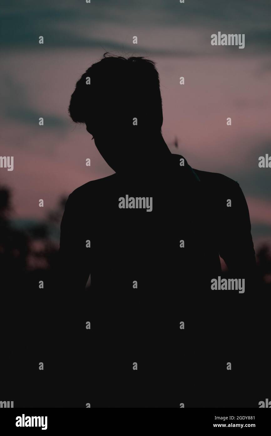 Portrait of a man enjoying the Sunset. Concept of Alone boy. Sunset ...