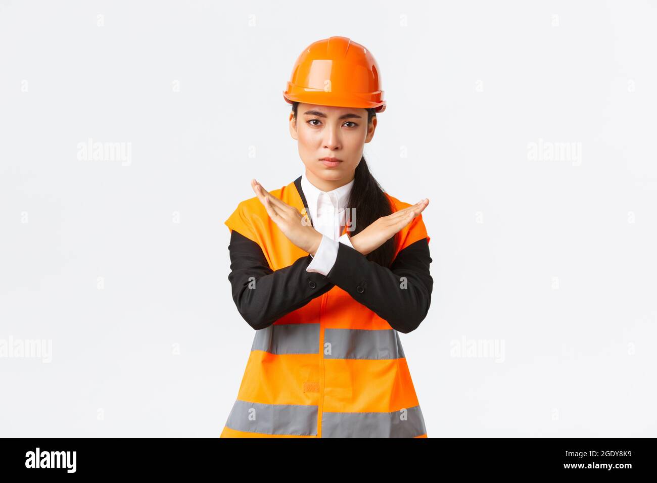 Serious-looking fed up asian female boss, construction manager in ...