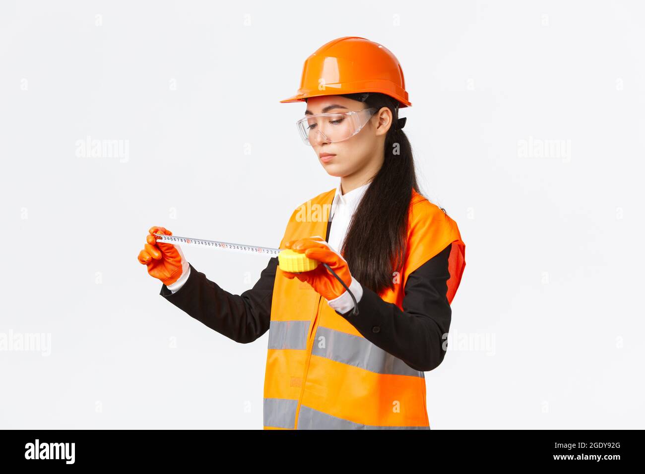 Serious asian female construction engineer, technician inspect layout ...