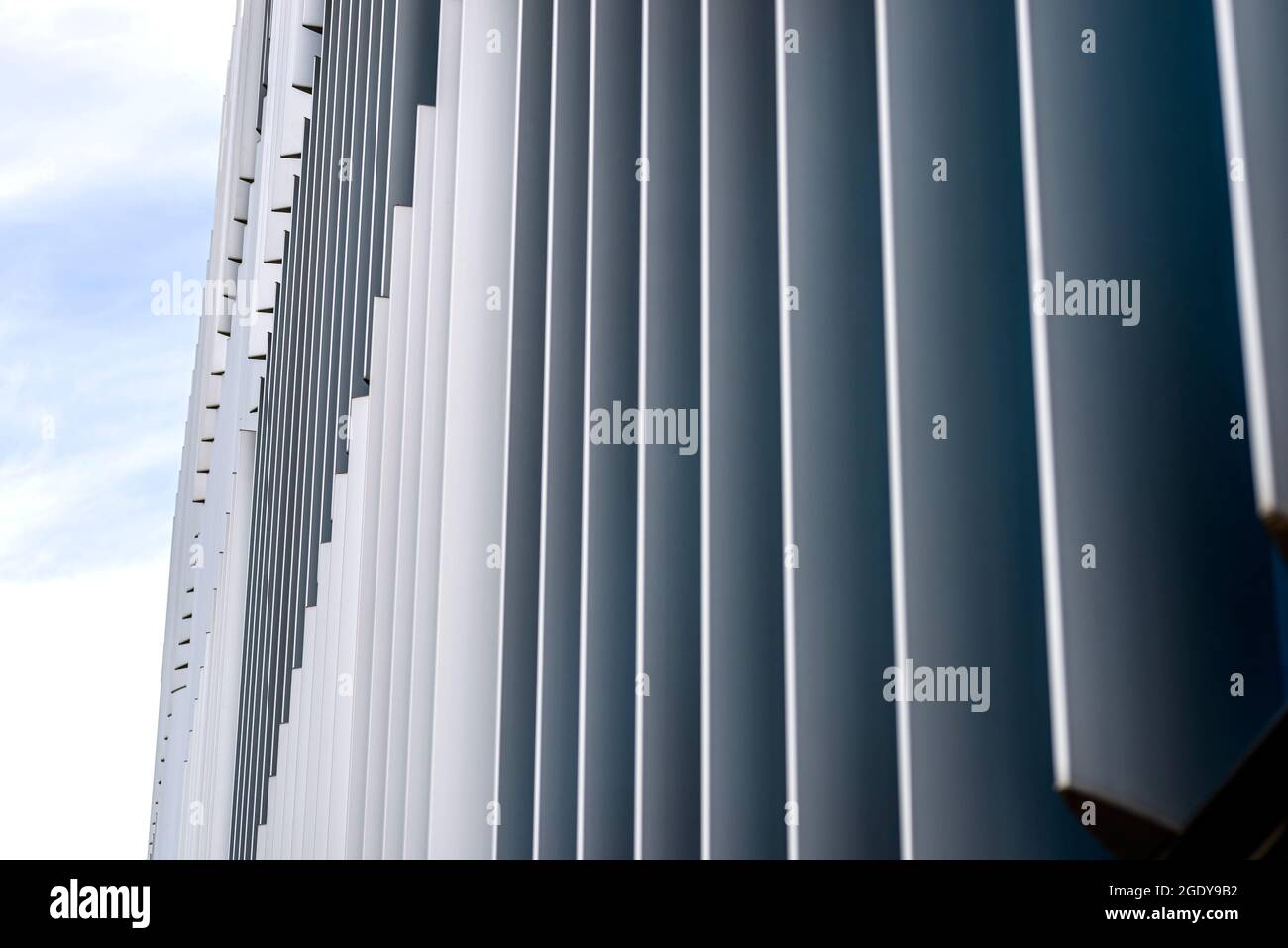 The facade of a modern building with an innovative facade made of ...