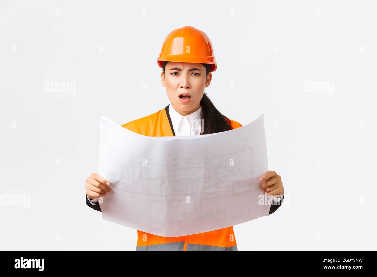 Frustrated and displeased female asian engineer, chief architect at ...