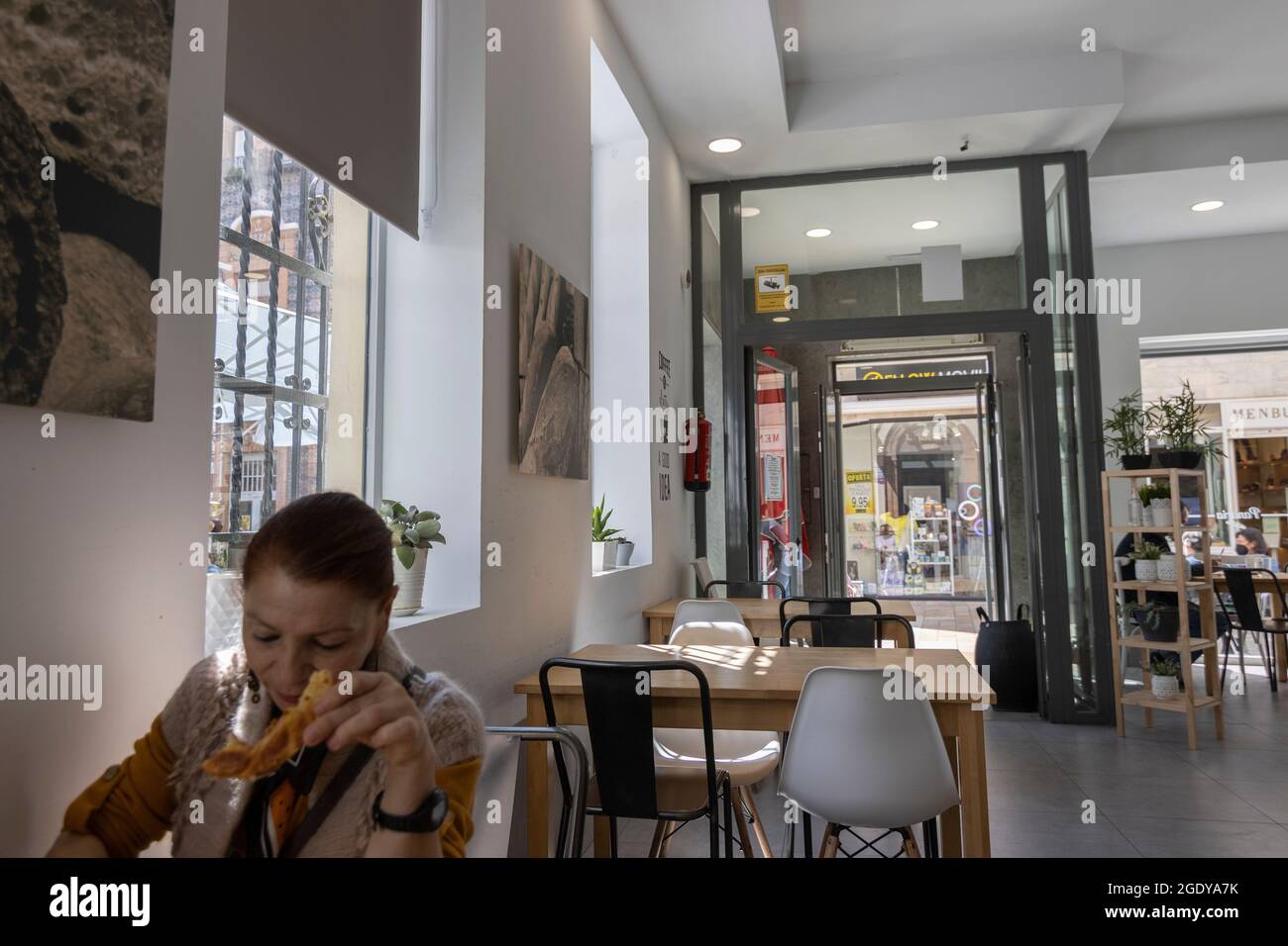 Huelva, Spain;03.27.2021:A woman having breakfast in an avant-garde ...