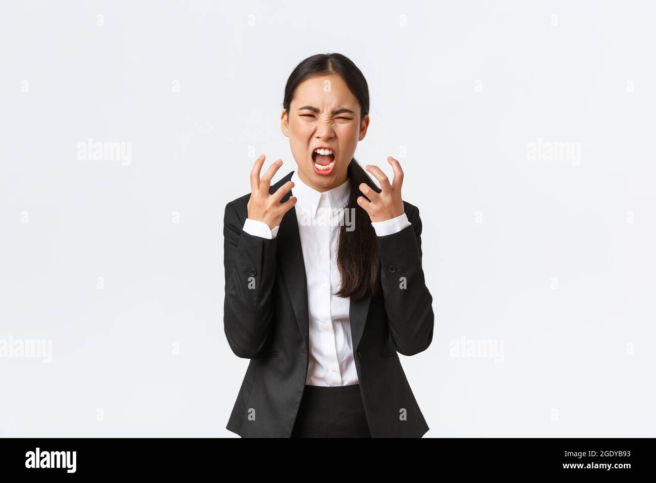 Mad disappointed CEO angry at employees. Outraged asian female manager ...