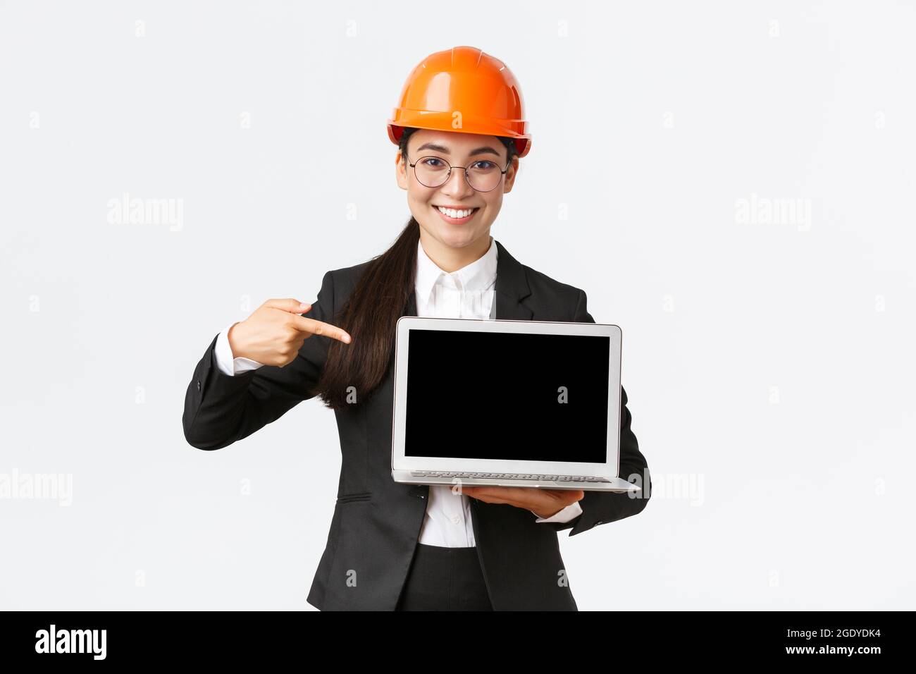 Smiling pleased asian female chief engineer showing chart with ...