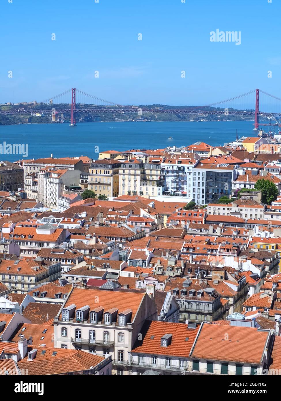 An aerial view of Lisbon city with red 25 April bridge and Tejo river ...