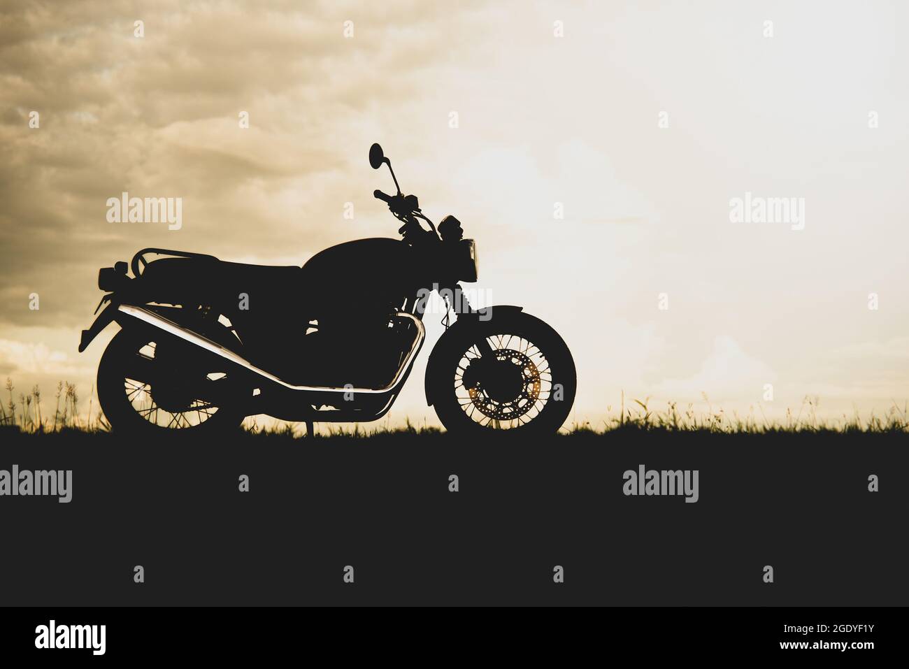 black shadow classic motorbike beautiful sunset sky background Stock ...