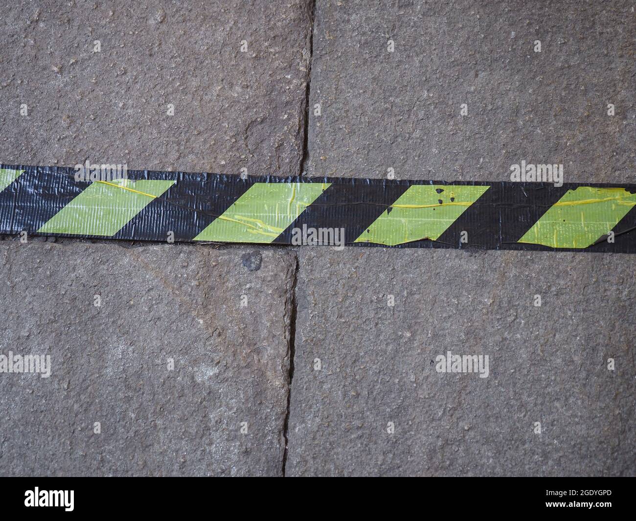 black and yellow line danger warning sign Stock Photo - Alamy