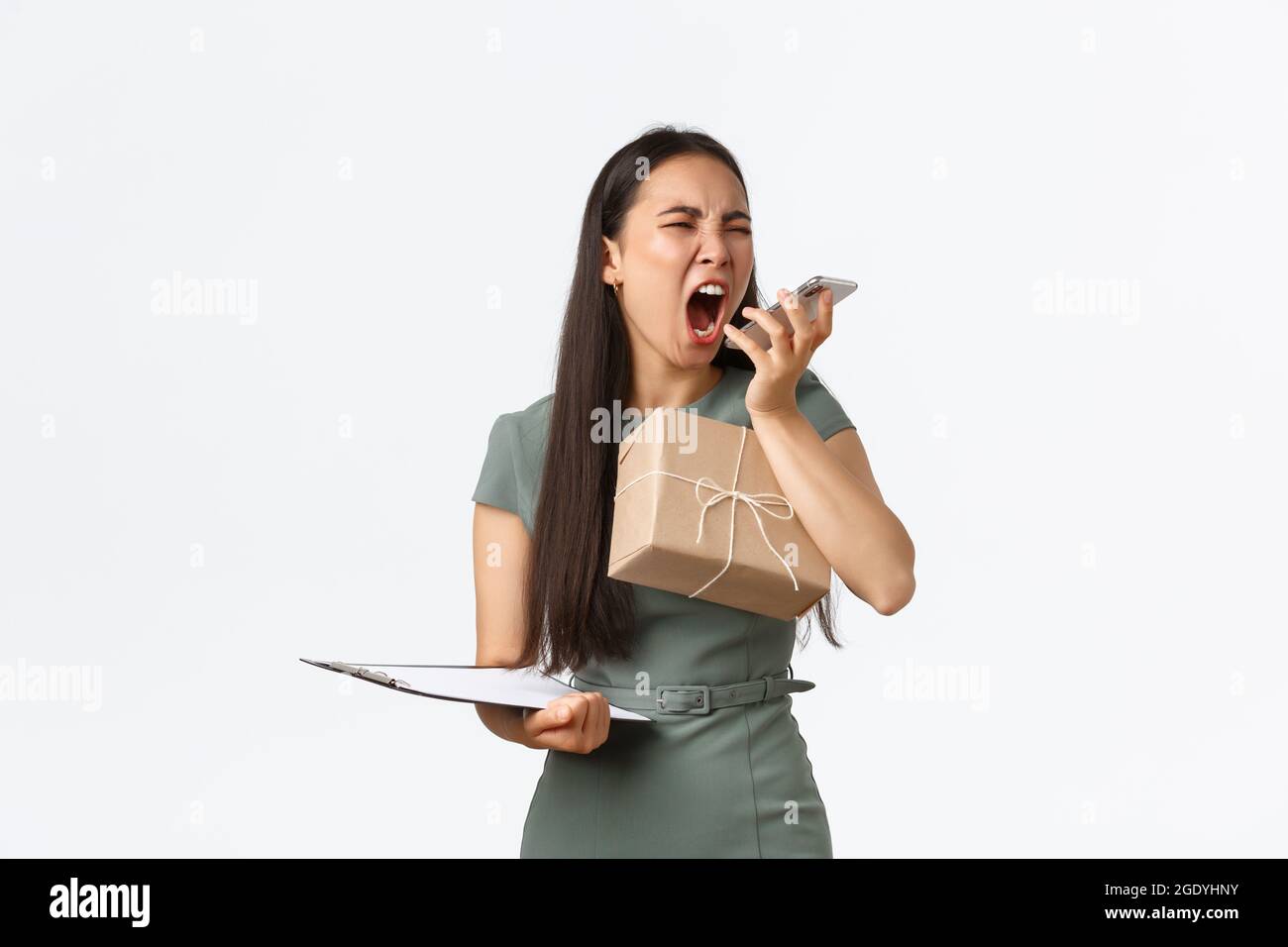 Pissed-off angry asian female business owner, shop manager yelling at ...