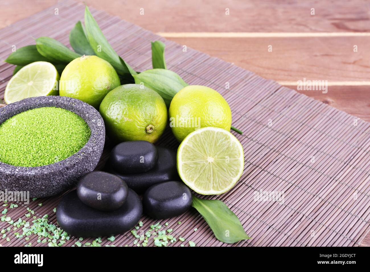 Spa still life on bamboo mat and wooden table background Stock Photo ...