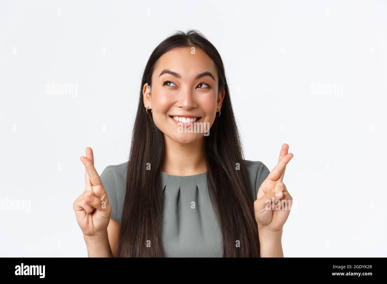 Close-up of dreamy happy asian woman smiling optimistic, having hope in ...