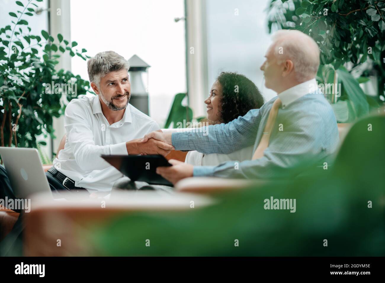 business partners completing the transaction a strong handshake Stock ...