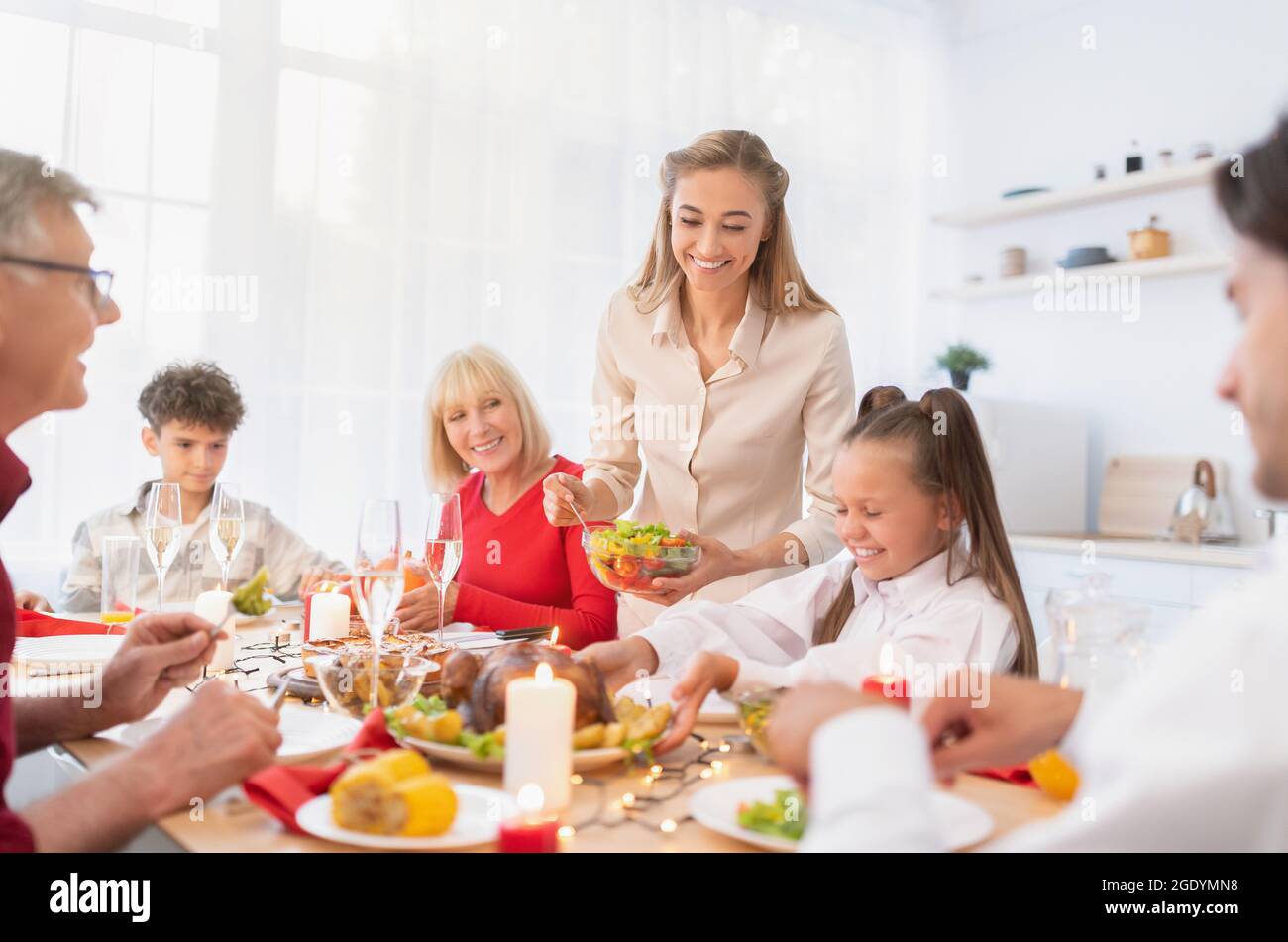 Happy extended multi generation family celebrating Thanksgiving or ...