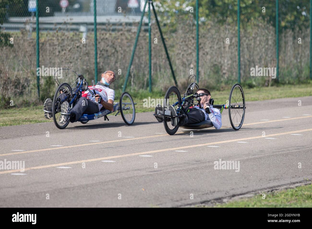Couple of Disabled Athlete training with Their Hand Bikes on a Track ...