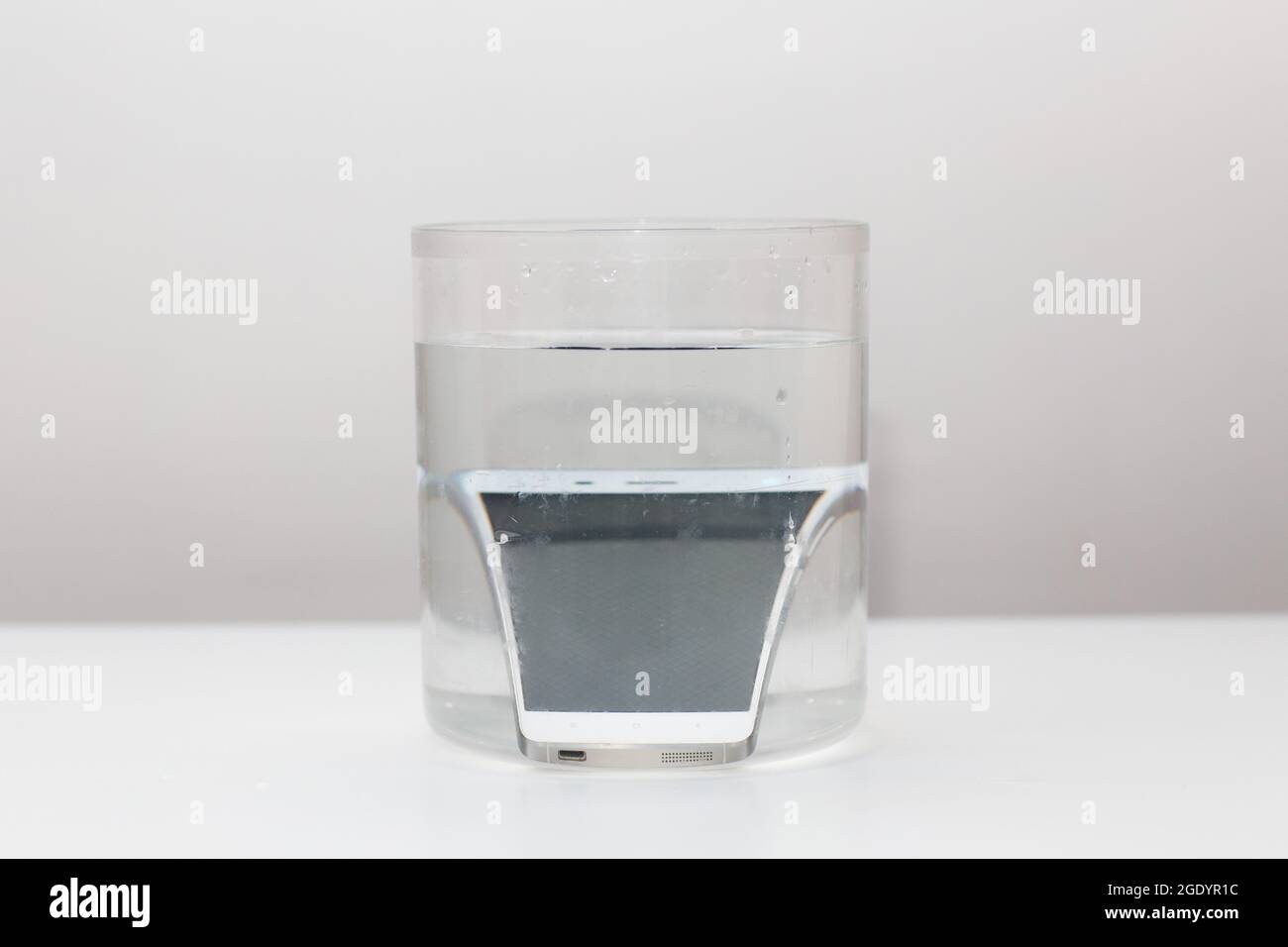 Mobile phone waterproof in vessel with water Stock Photo - Alamy
