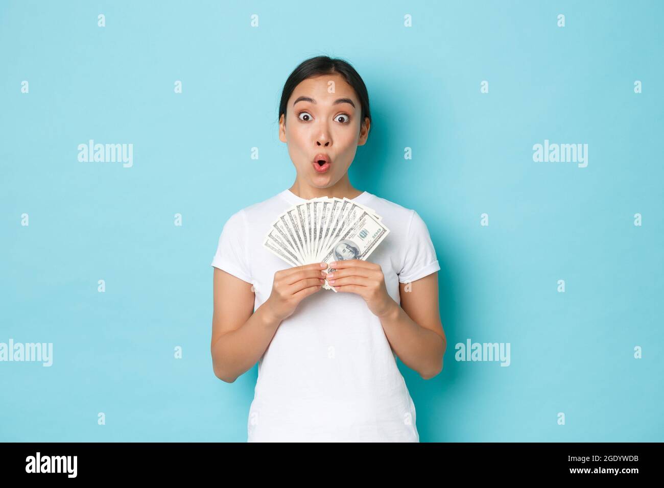Shopping, money and finance concept. Excited happy asian girl showing ...