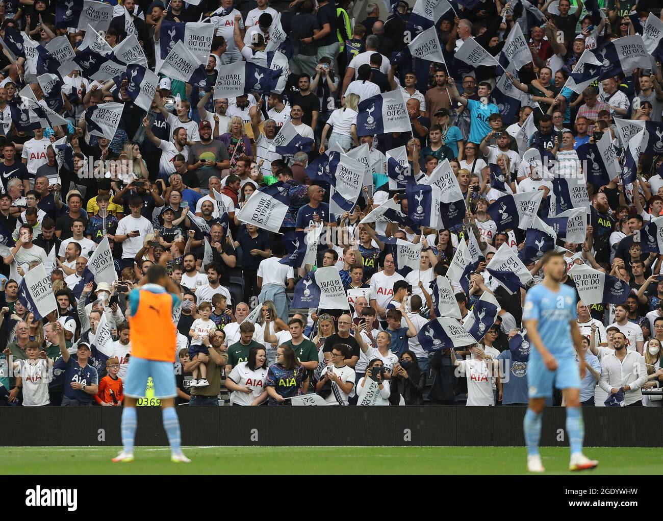 London, England, 15th August 2021. Tottenham fans waves flags as they ...
