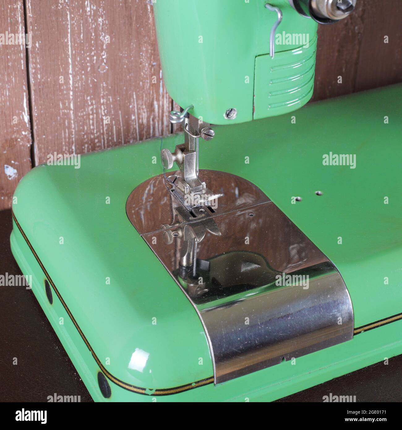 Household appliances - Closeup fragment old retro green sewing machine ...