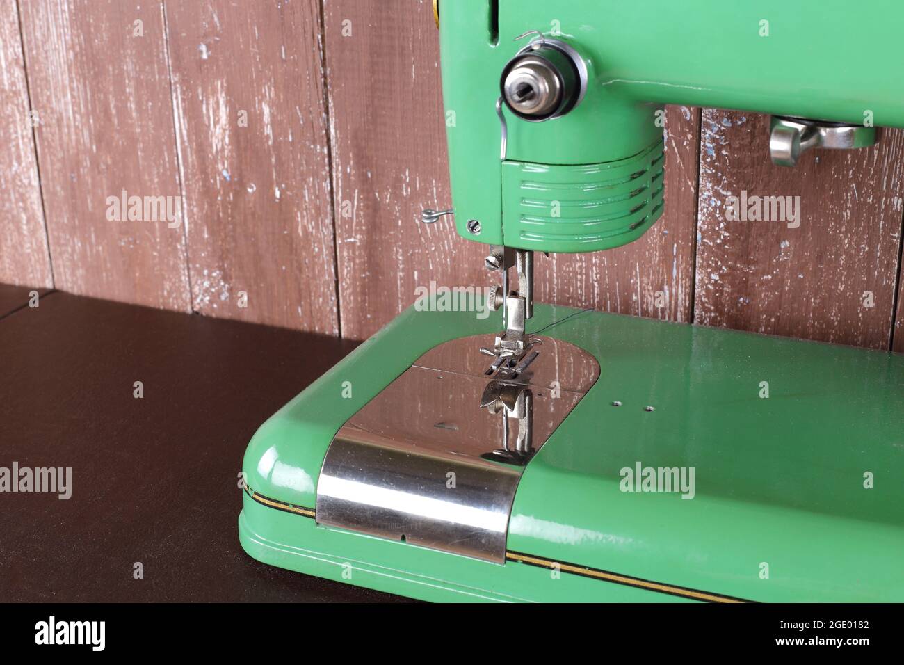 Household appliances - Closeup fragment old retro green sewing machine ...