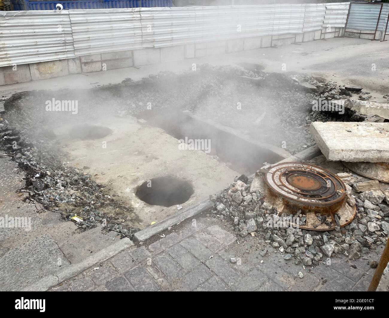 Repair of the heating main. The underground pipe through which steam ...