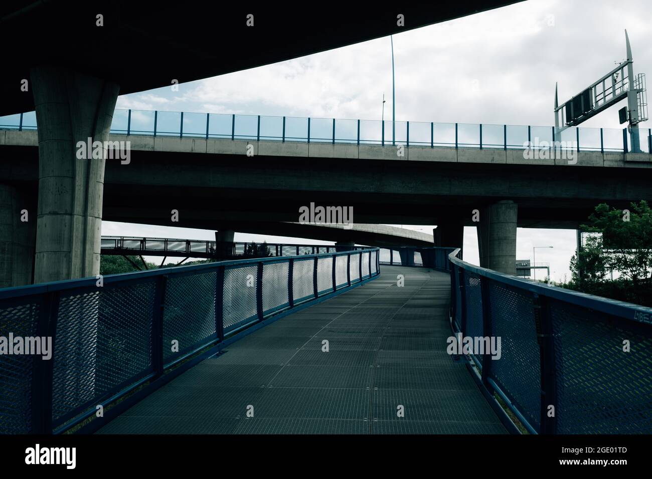 A pathway under the bridge Stock Photo - Alamy